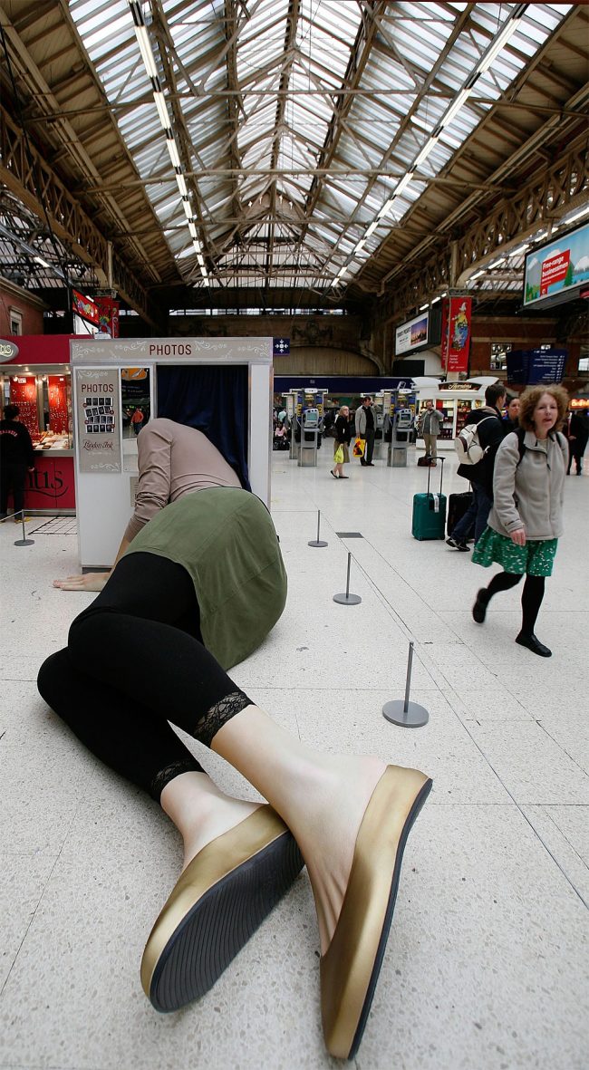 This Stunning Sculpture Of A Giant Lady With Her Head Stuck In A Photo ...