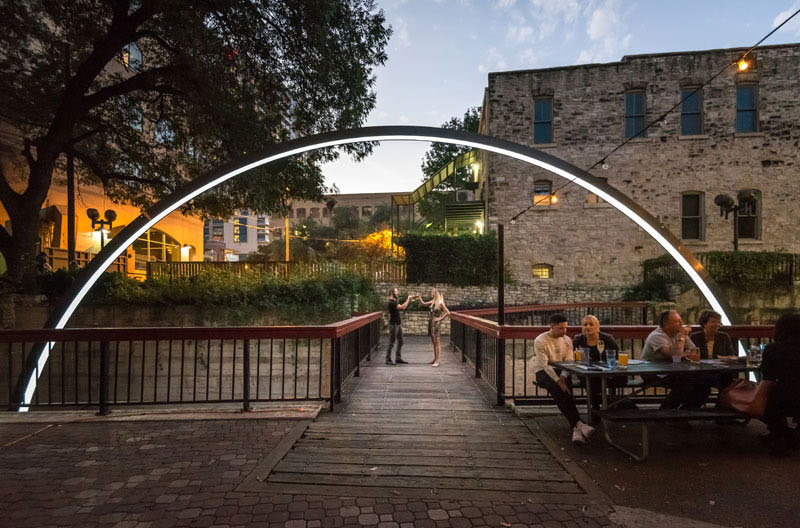 This Illuminated Arch Rises Up Out Of The Water And Surrounds A Foot ...