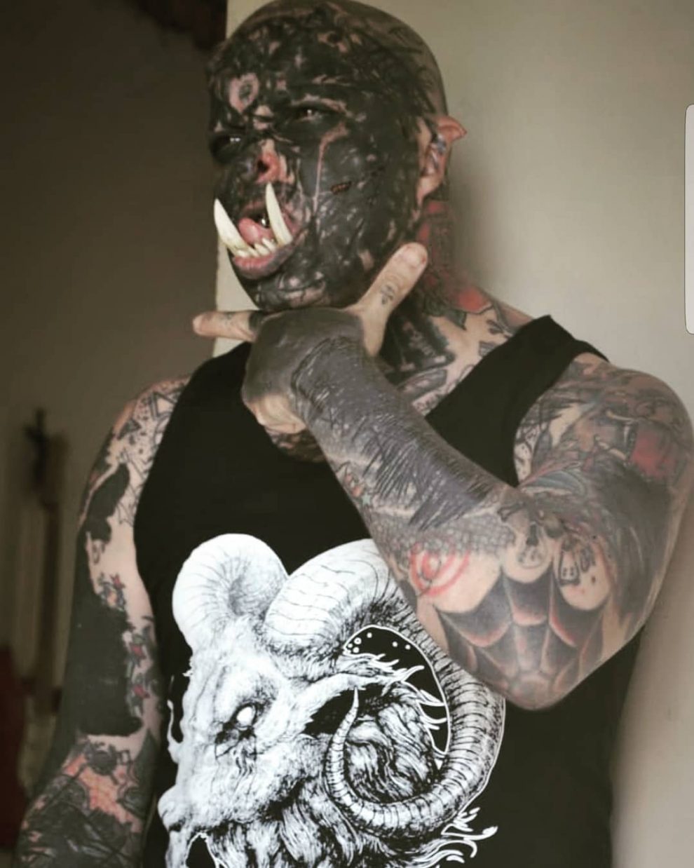 Real-Life Orc: Brazilian Tattoo Artist Has Giant Tusks Implanted to ...