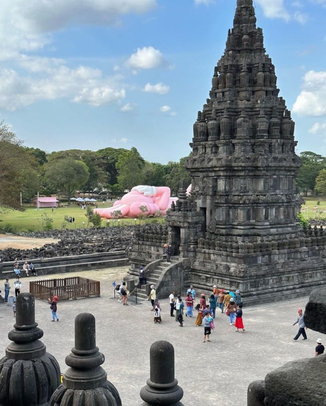 KAWS Unveils Colossal 150ft Pink Rabbit Sculpture at Prambanan Temple ...